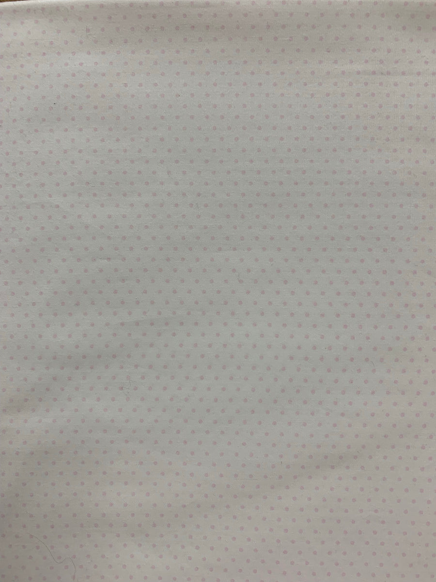 Soft pink dots on white background sold in 25cm units